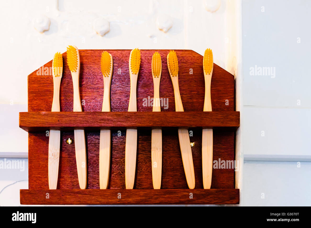 Gentleman's wooden rack with seven toothbrushes, one for each day of ...