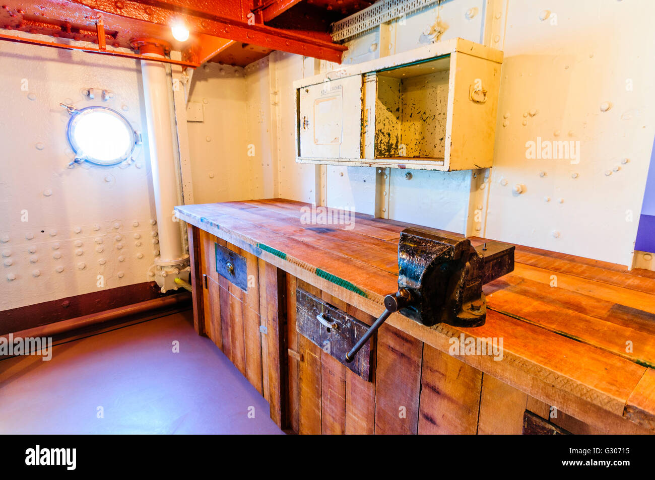 Engineer's workshop with bench and vice on board an old ship Stock ...