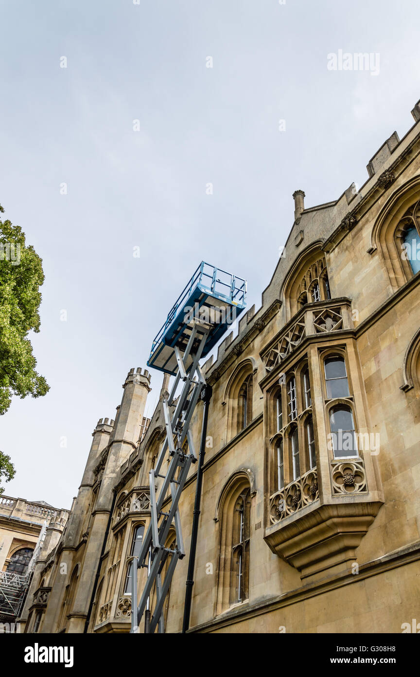Telescopic boom lift in an old public building. Low angle view Stock ...