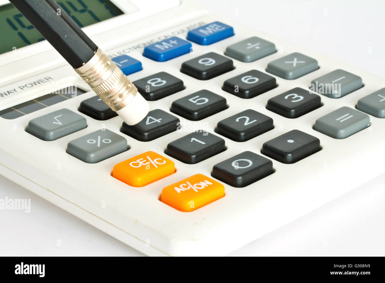 calculator and pencil on white background Stock Photo - Alamy