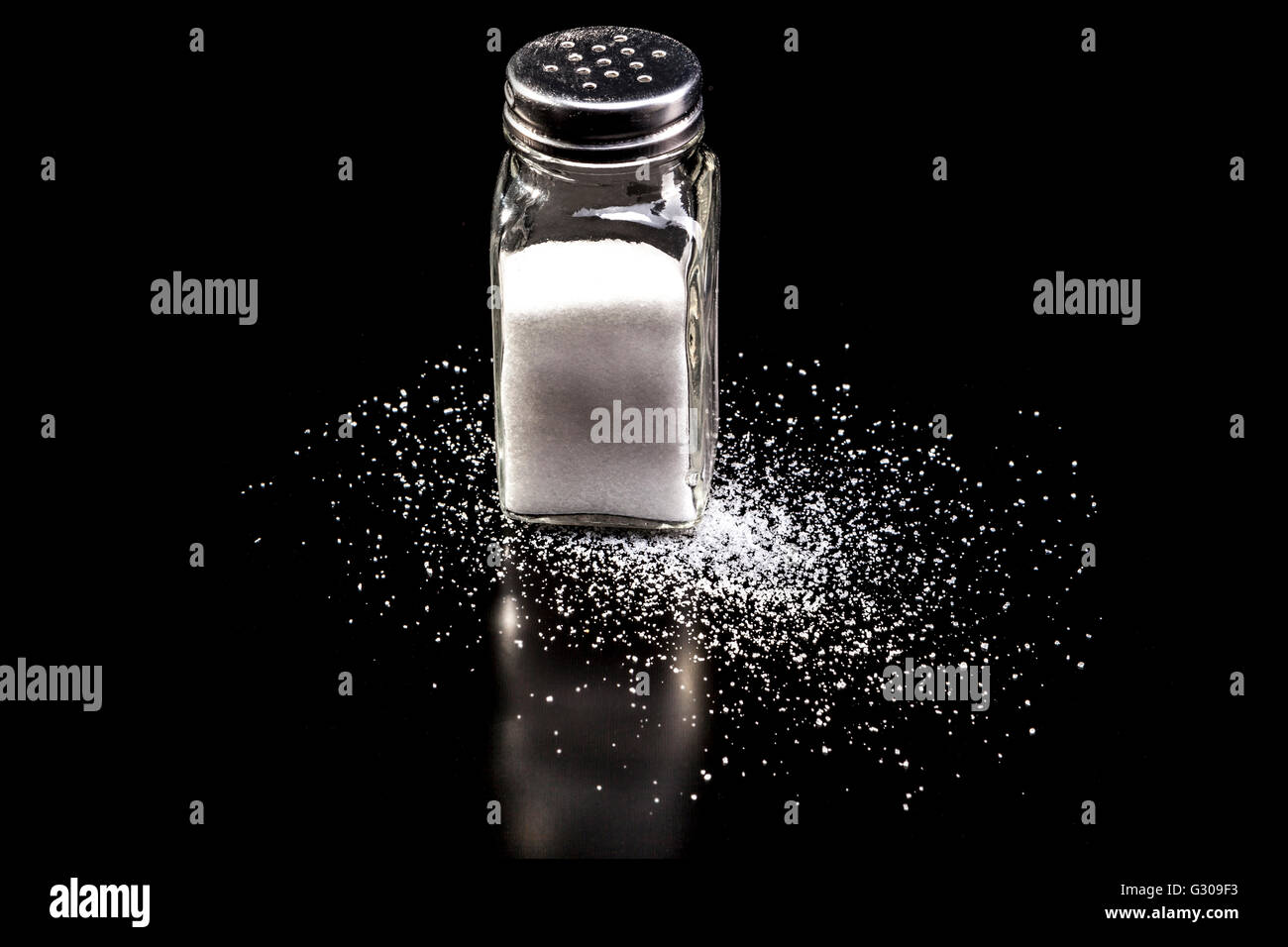 Jar with salt isolated on black background with reflection Stock Photo ...