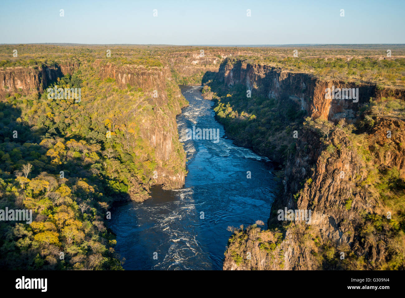 Aerial view of sunlit canyon and river Stock Photo - Alamy