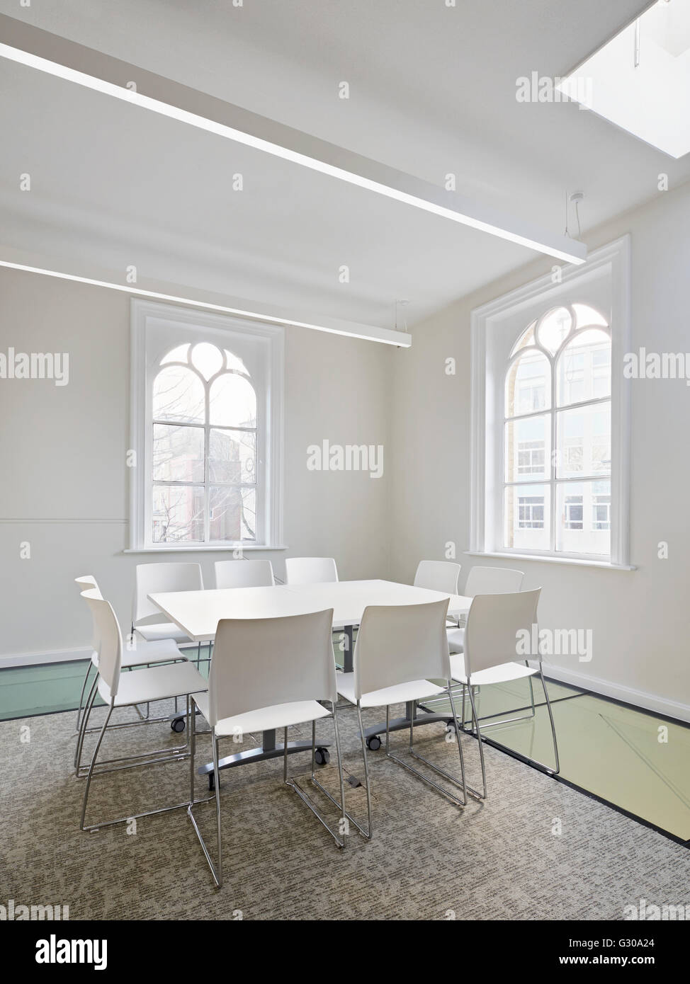 Crit meeting room with opaque glass covering the old preserved ...