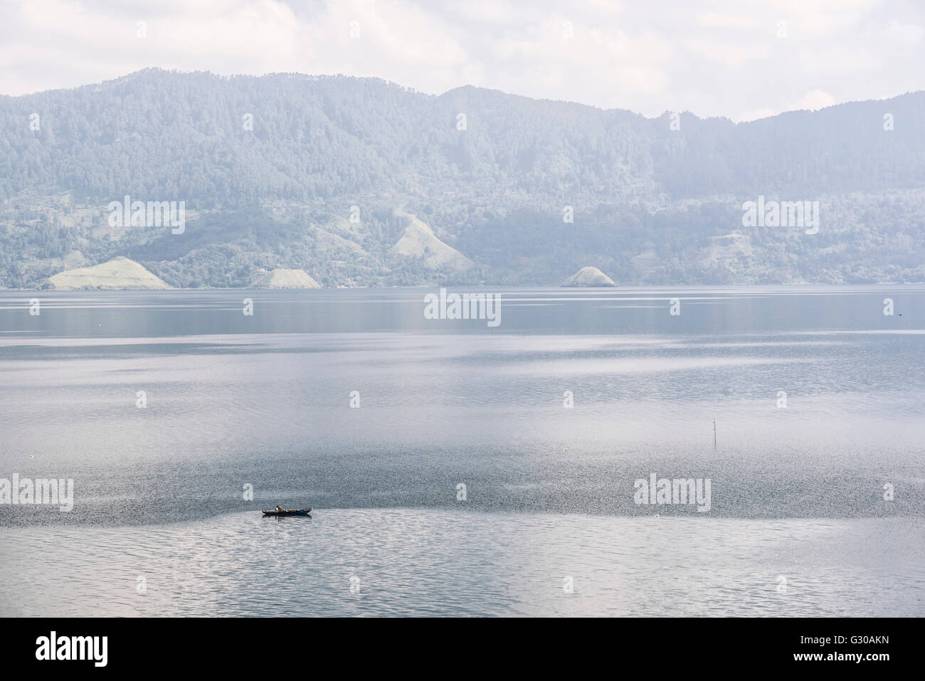 Fishing boat on Lake Toba (Danau Toba), the largest volcanic lake in ...