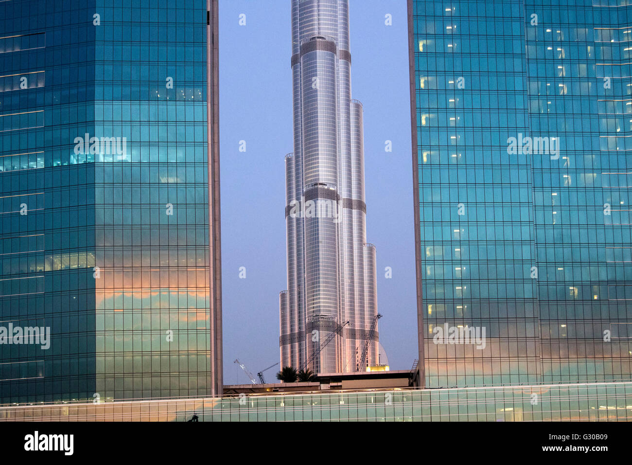 Burj Khalifa between two shiny skyscapers dusk Stock Photo - Alamy