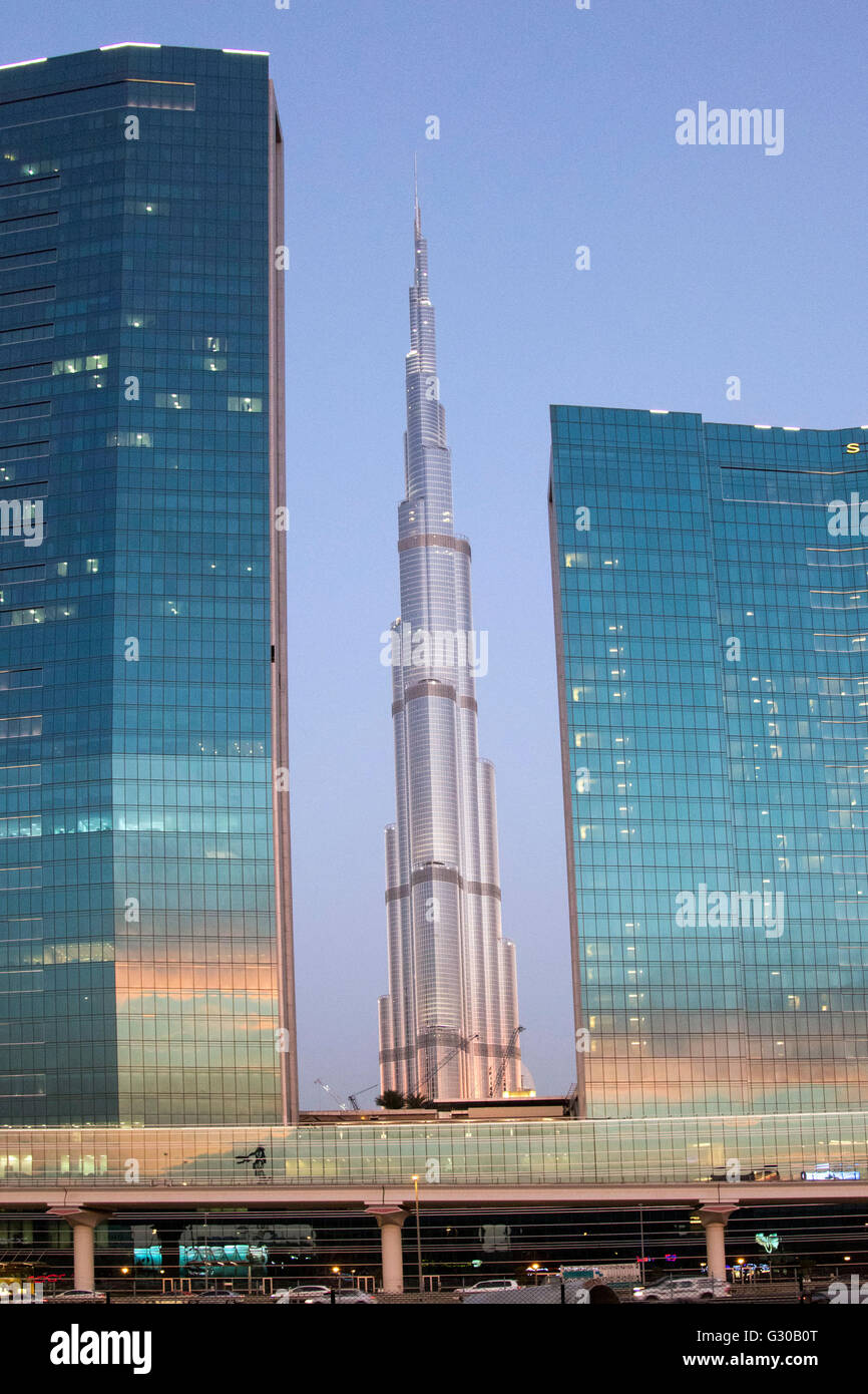 Burj Khalifa between two shiny skyscapers dusk Stock Photo - Alamy