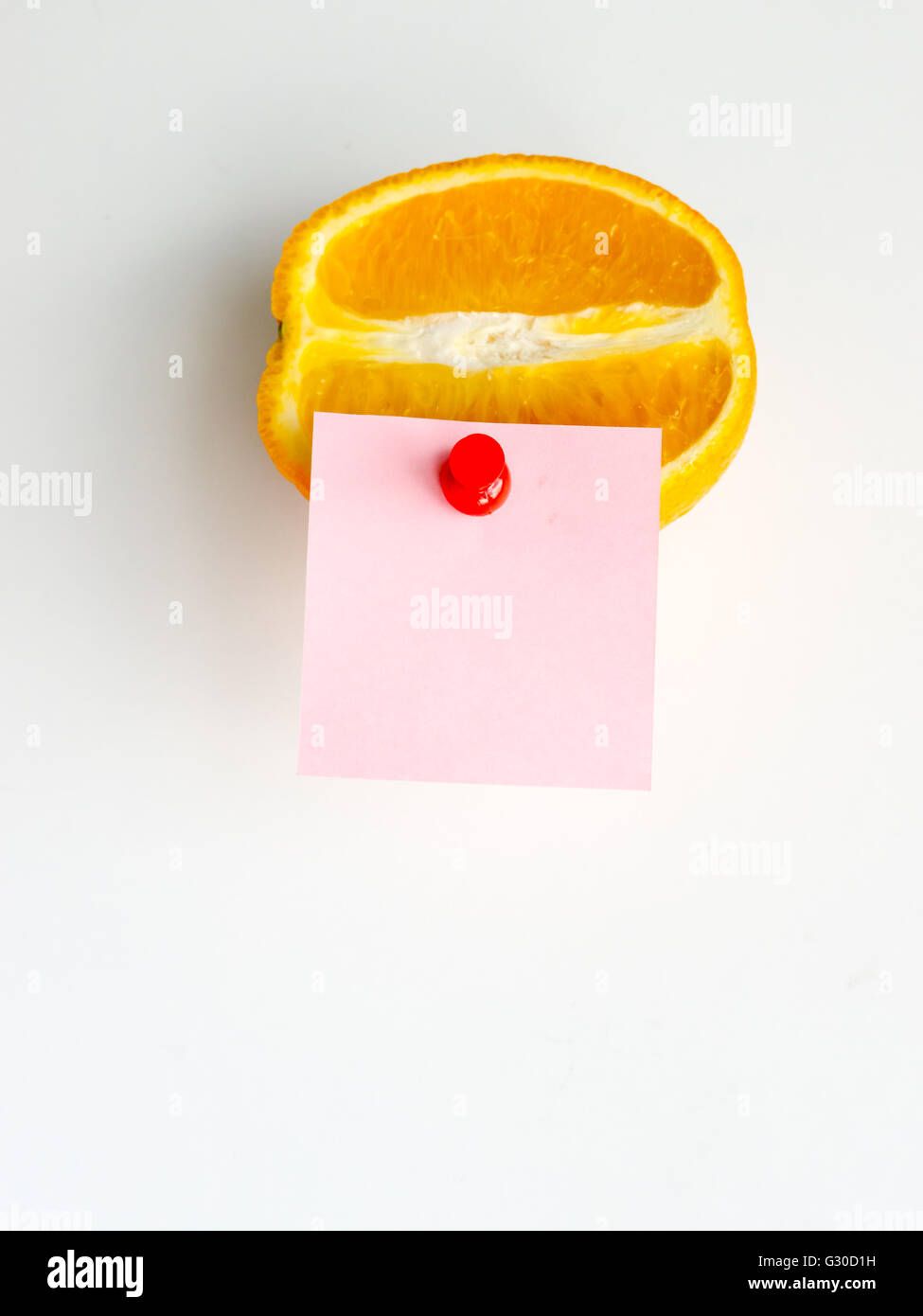 Orange fruit on white background with label Stock Photo - Alamy