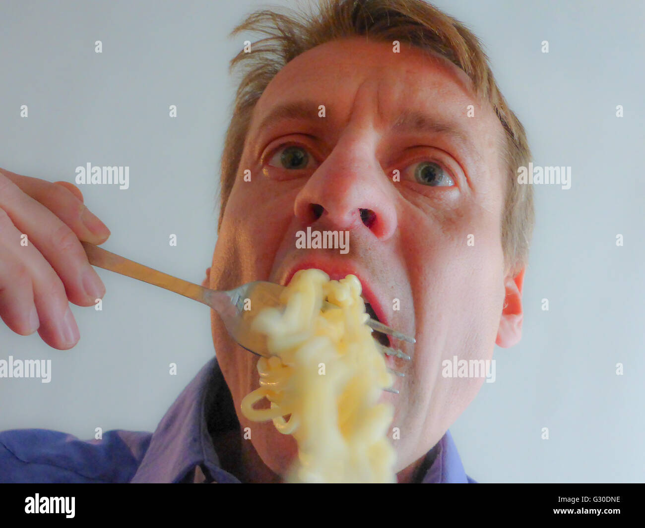 Man eating spaghetti Stock Photo - Alamy