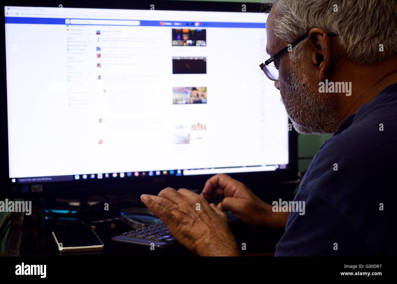 Senior Men working desktop computer at late night Stock Photo - Alamy