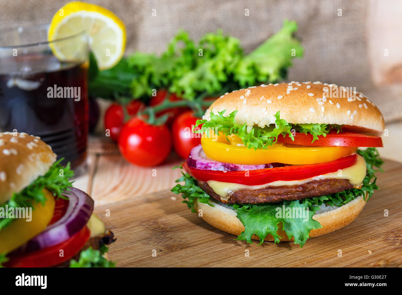 hamburger and drink with slice of lemon Stock Photo - Alamy