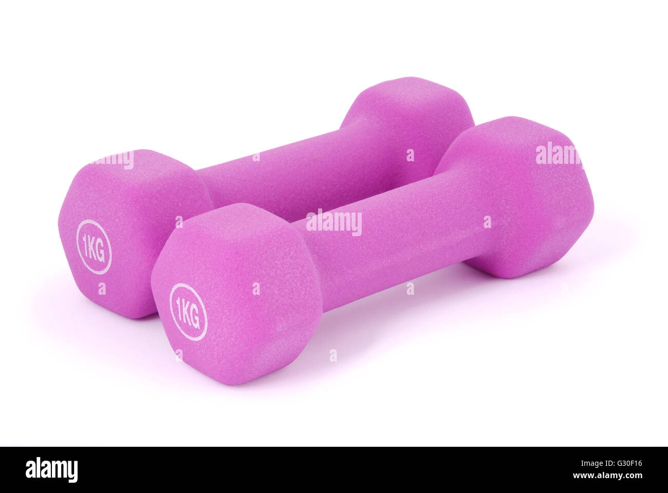 pink dumbbells in hand. Isolated on white background with soft shadow ...