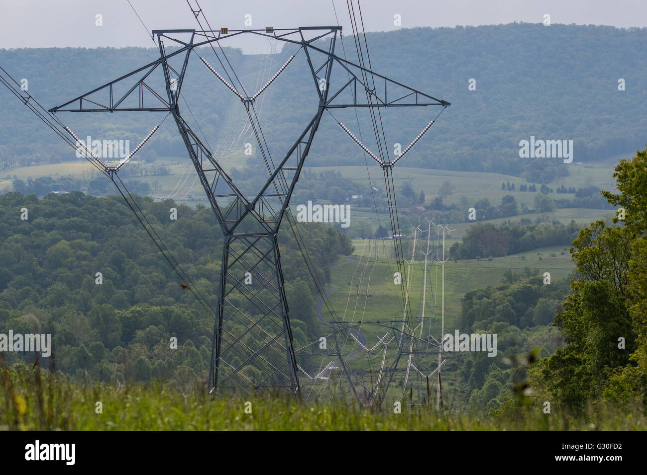 Industrial Power Lines Running Over Mountains in rural Maryland Stock ...