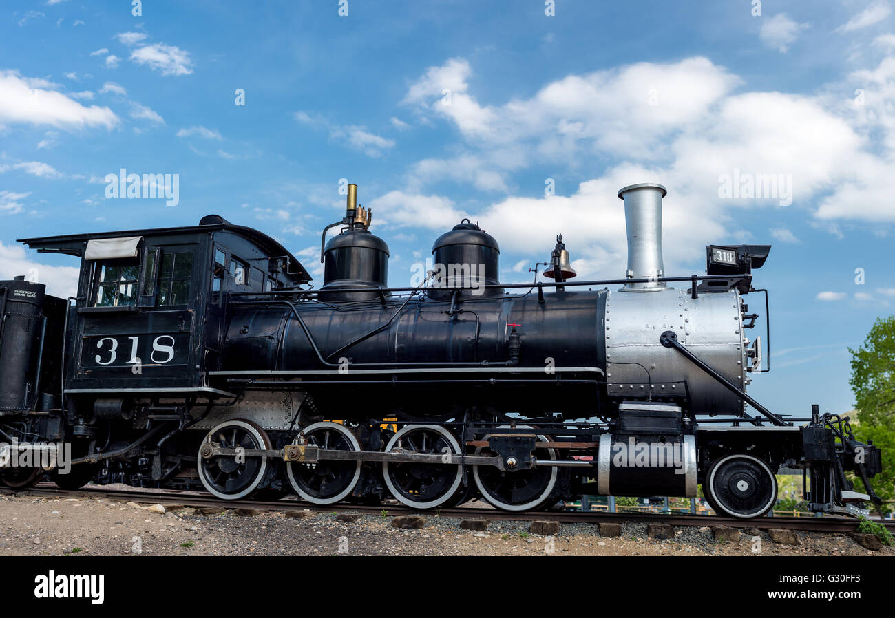 Old classic steam engine with blue sky and clouds Stock Photo - Alamy
