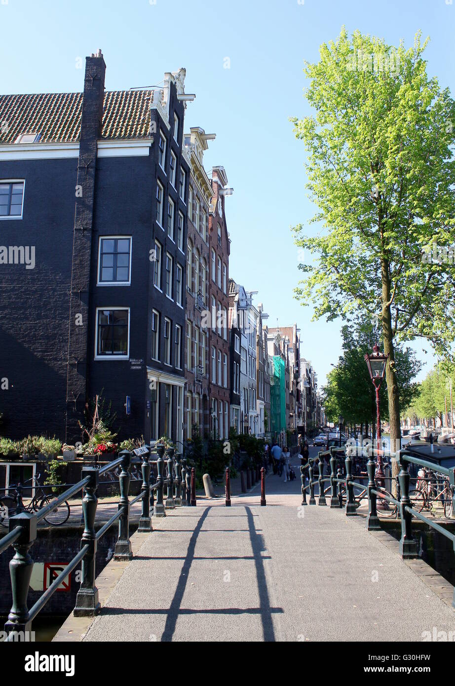 Old pedestrian bridge at Brouwersgracht canal in spring, Amsterdam ...