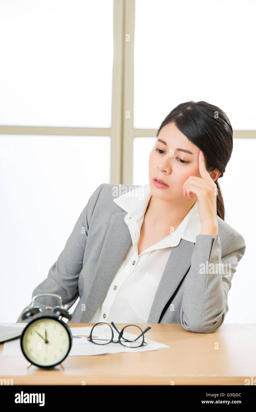 Exhausted asian Businesswoman overtime and overworked in office Stock ...
