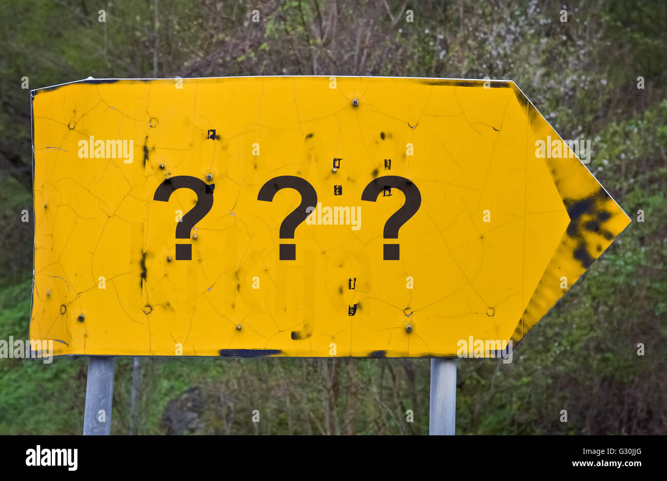 Three question marks written on a yellow road sign Stock Photo - Alamy