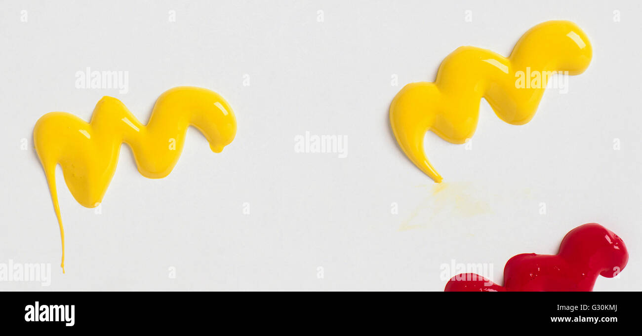 Squiggle of shiny yellow paint Stock Photo - Alamy