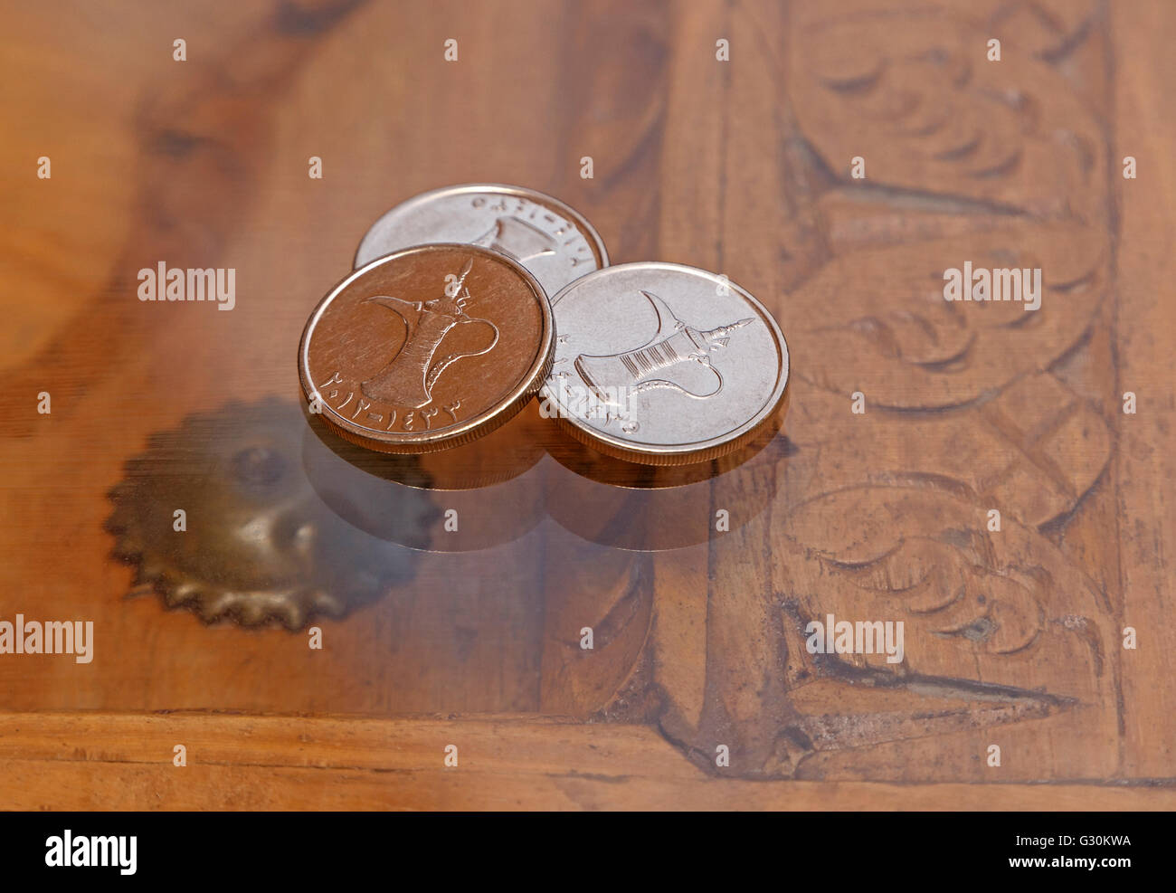 three dirham coins on table Stock Photo - Alamy