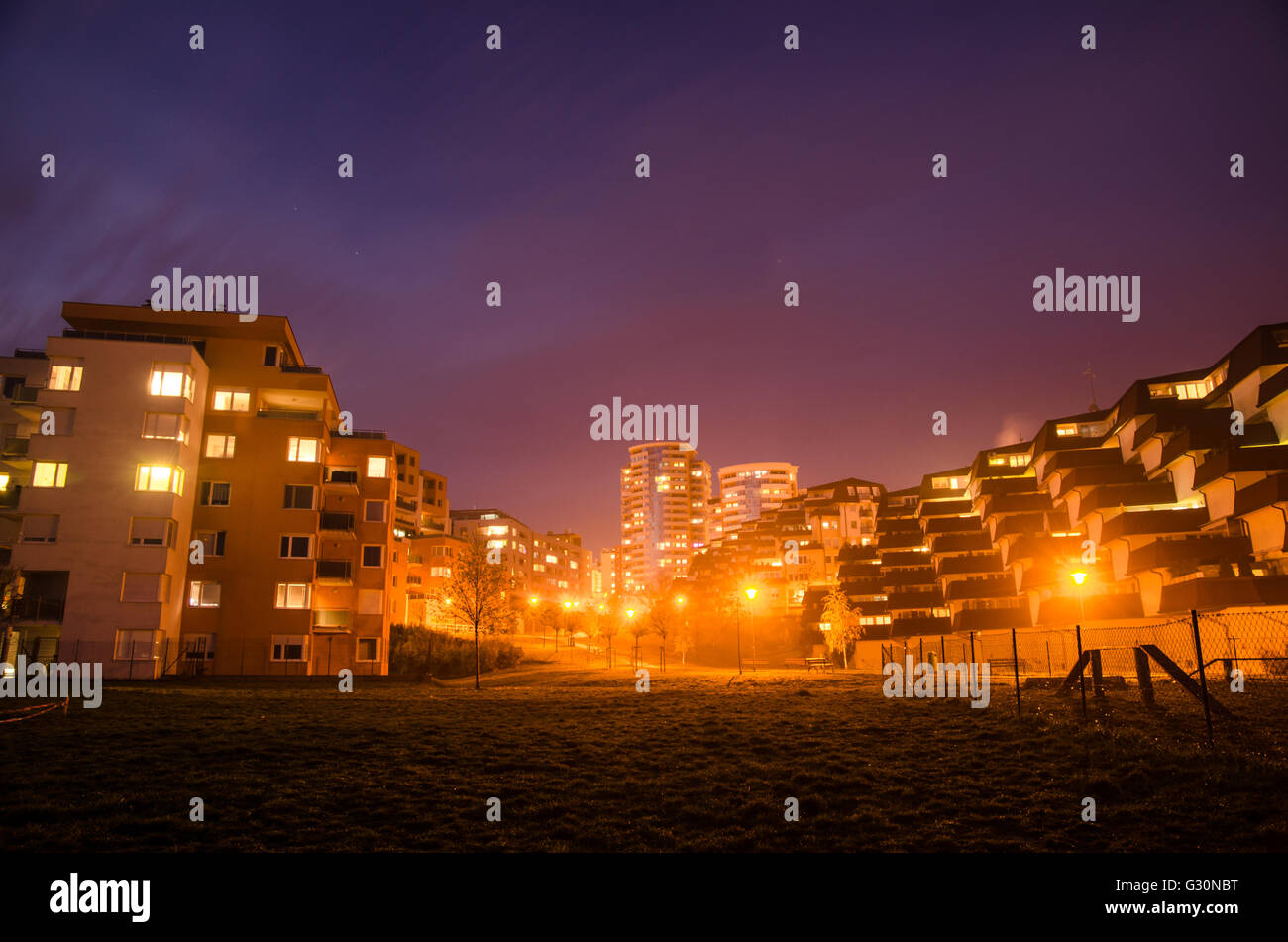 illuminated block of houses at night Stock Photo - Alamy