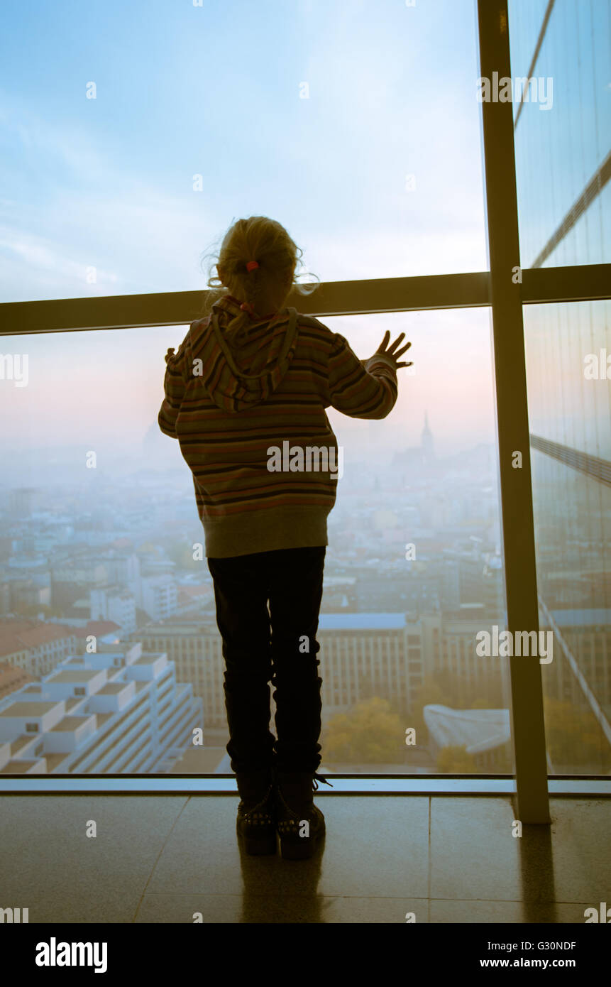little child standing by the window Stock Photo - Alamy