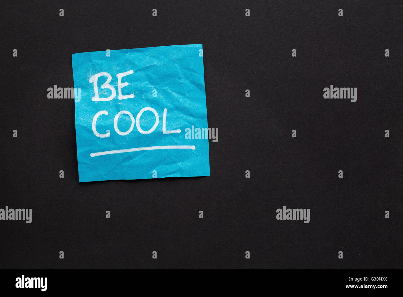 Be cool reminder - white marker handwriting on a sticky note against ...