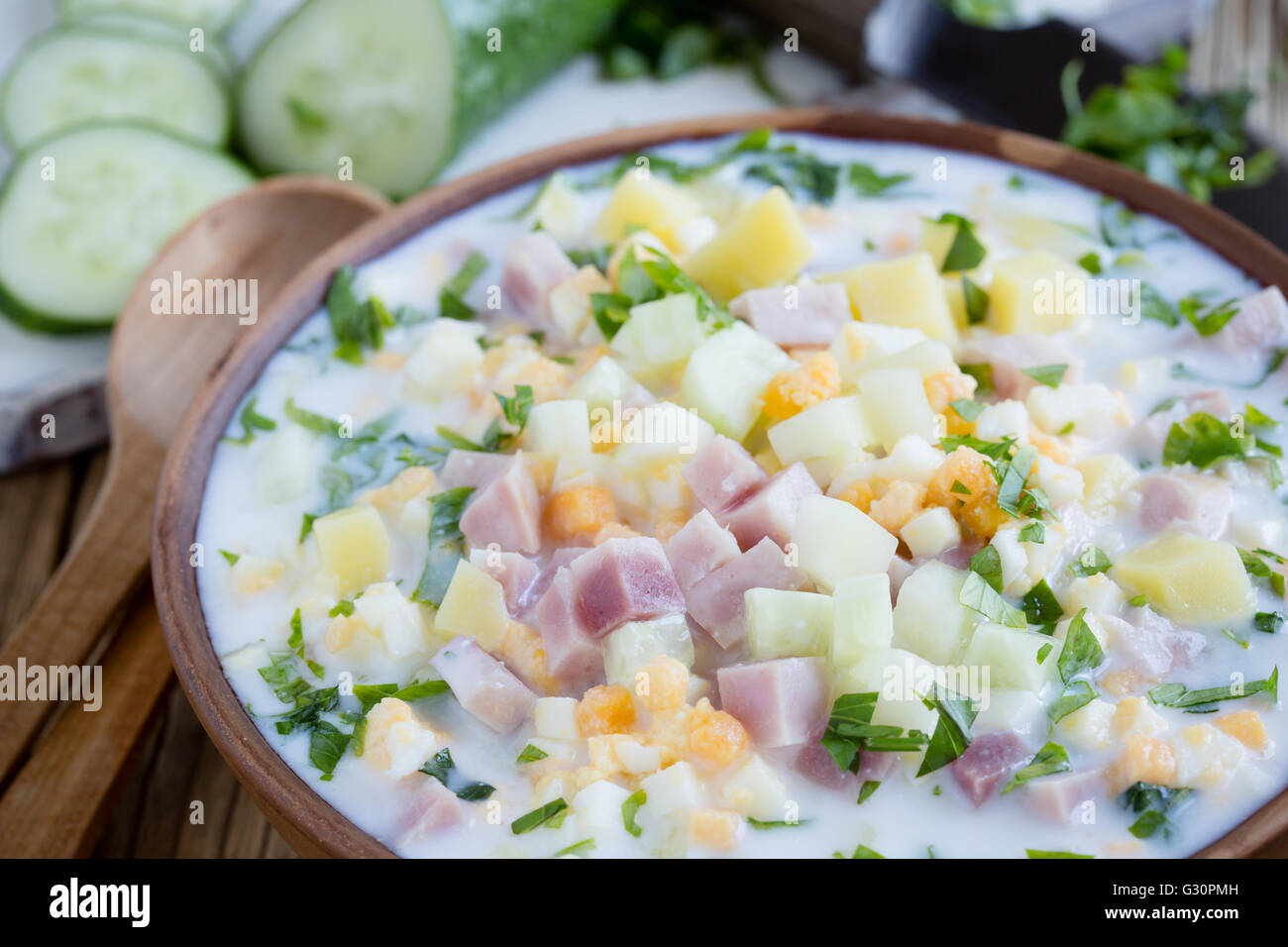 Traditional Russian summer cold soup okroshka with kefir in ceramic ...