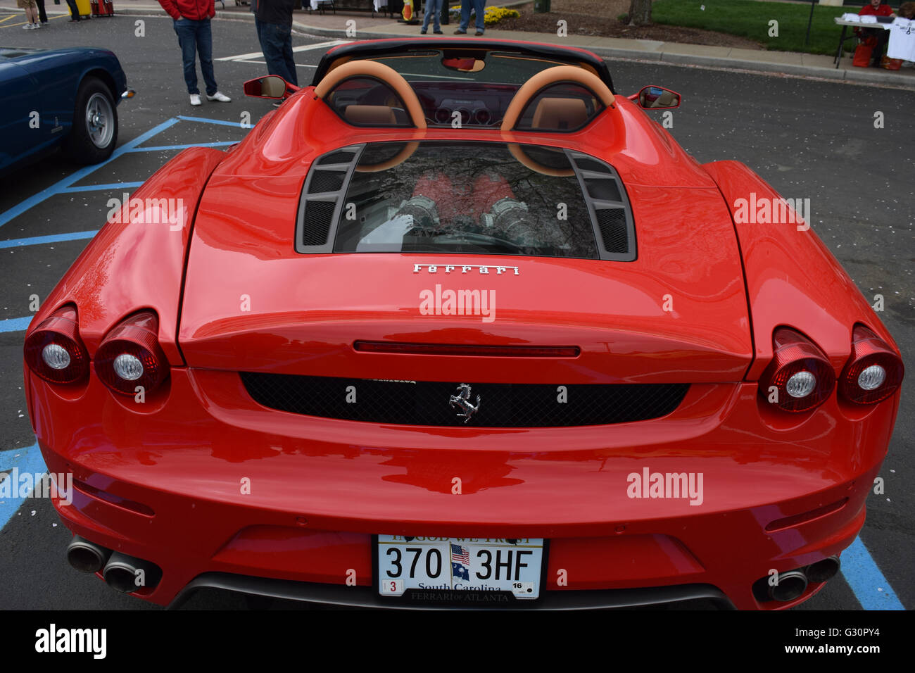 A red Ferrari on display at a car show Stock Photo - Alamy