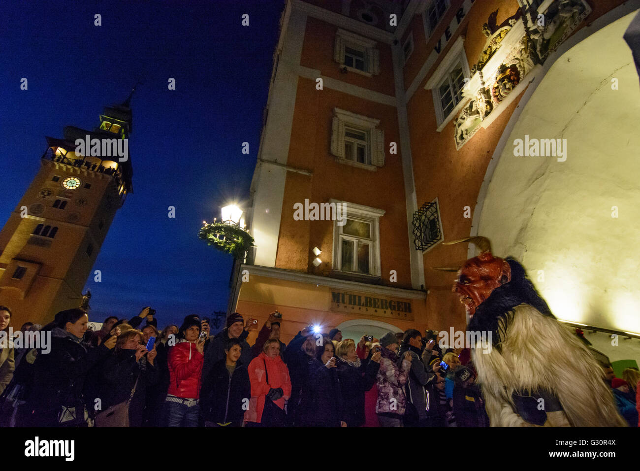 Perchtenlauf (mask procession) with Krampus in the main square in front ...