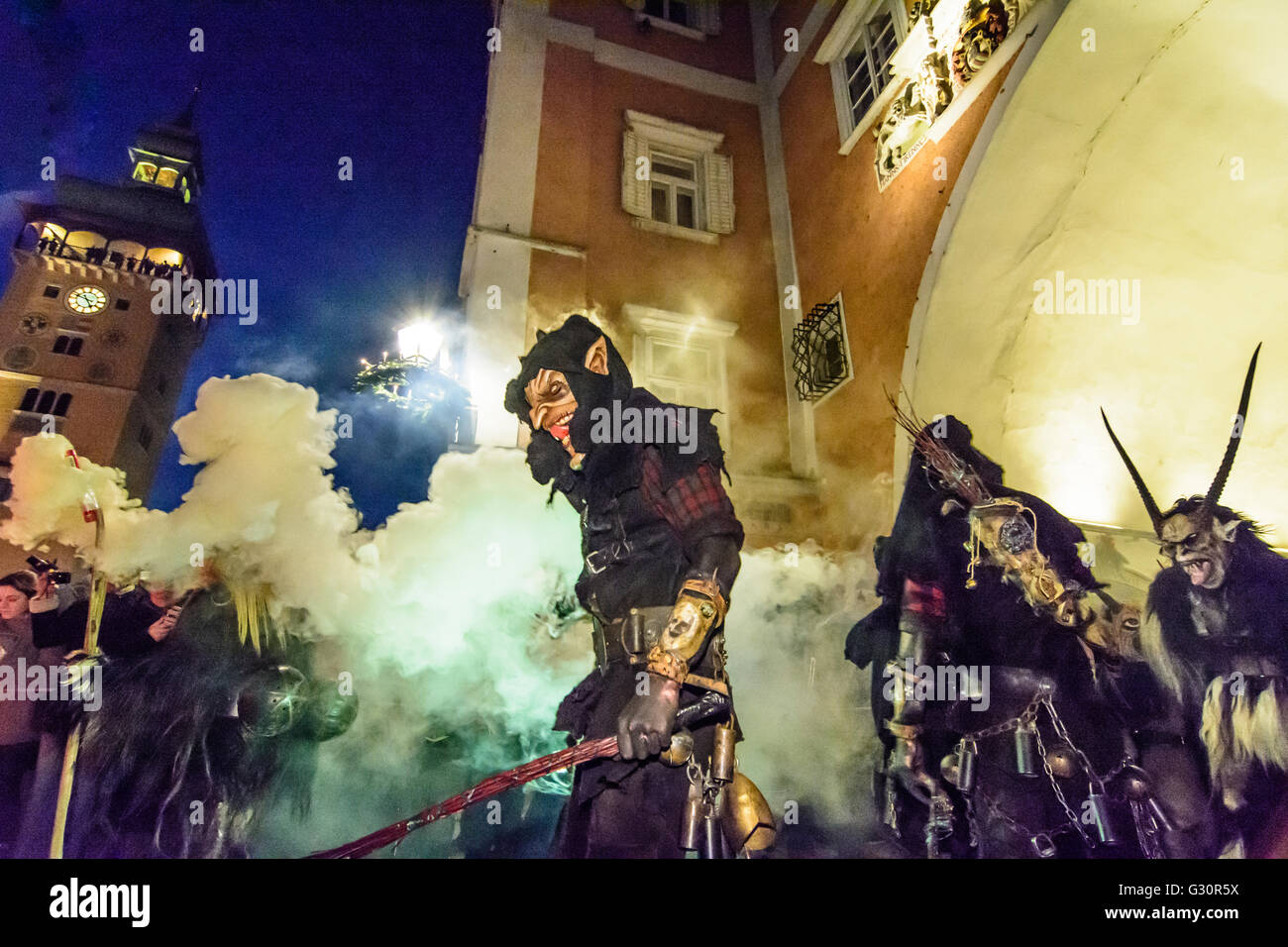 Perchtenlauf (mask procession) with Krampus in the main square in front ...