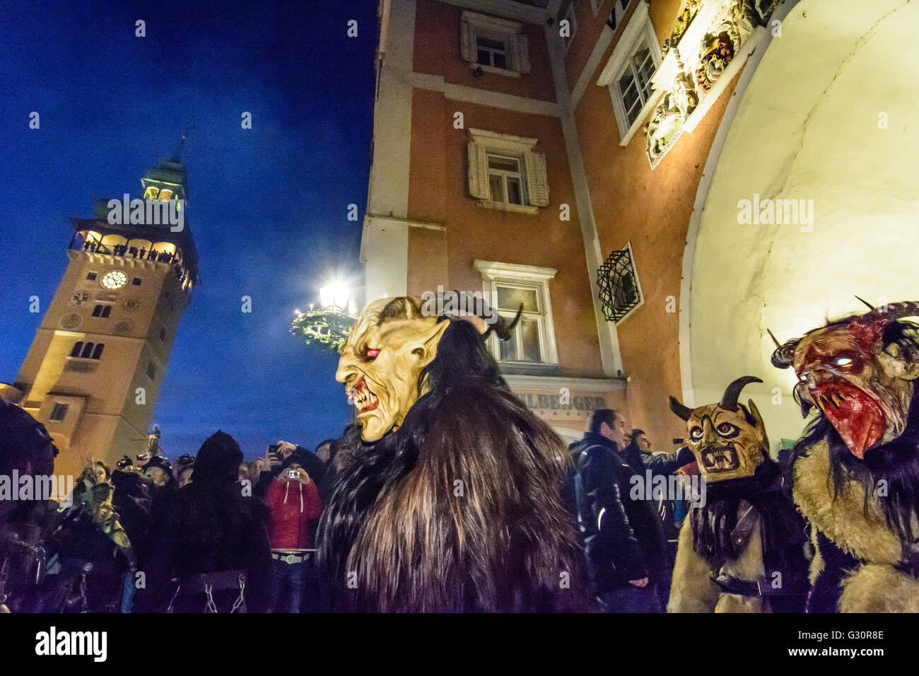 Perchtenlauf (mask procession) with Krampus in the main square in front ...