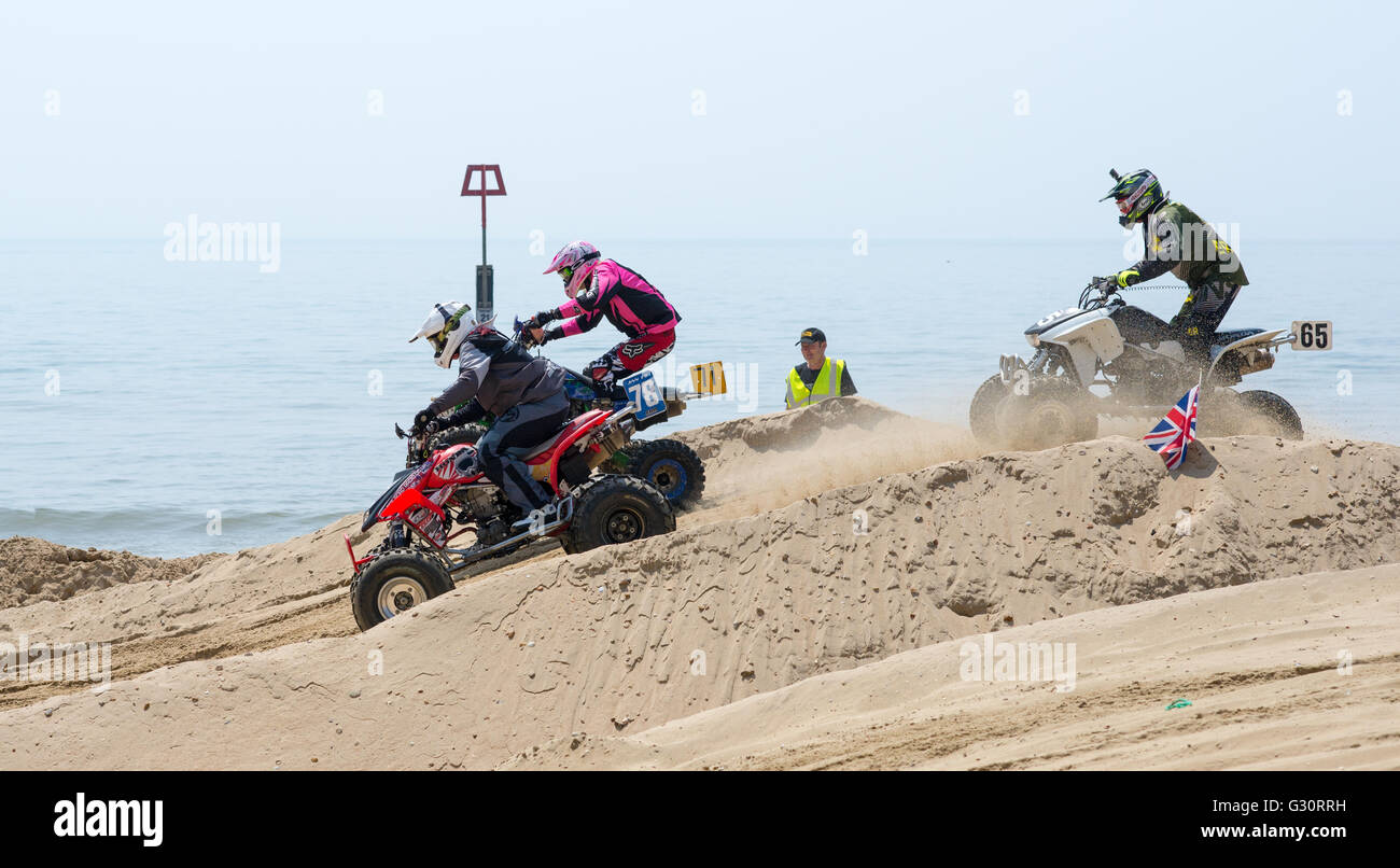 Quad bike racing around a prepared circuit at the Bournemouth Wheels ...