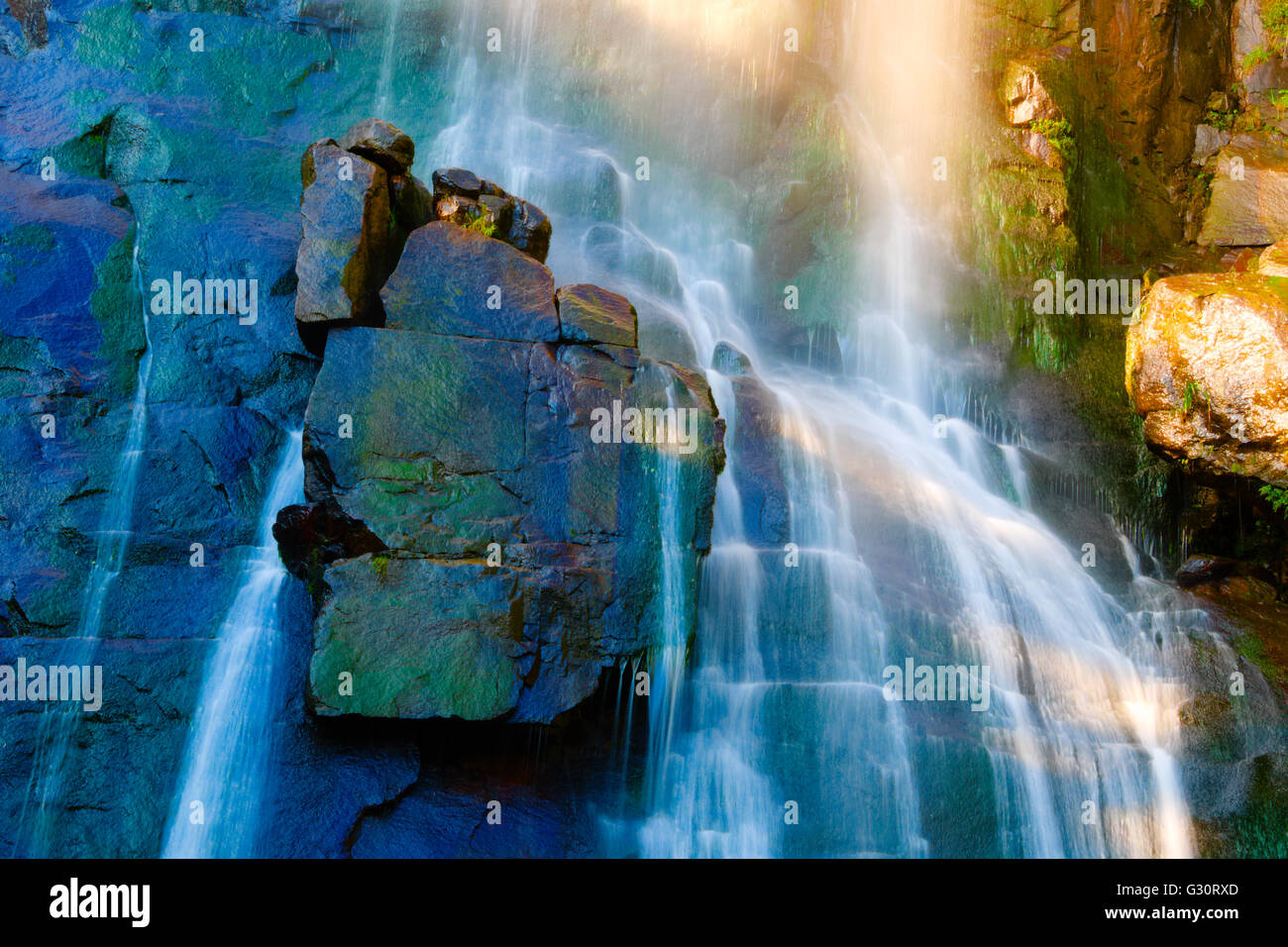 Beautiful and colorful close up of rock and water fall Stock Photo - Alamy