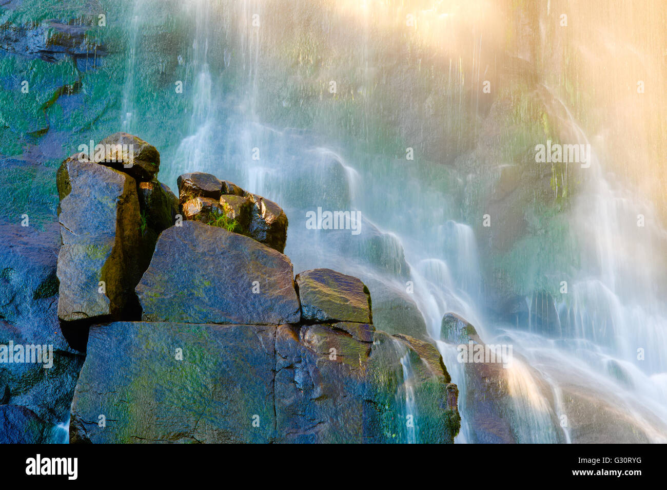Beautiful and colorful close up of rock and water fall Stock Photo - Alamy