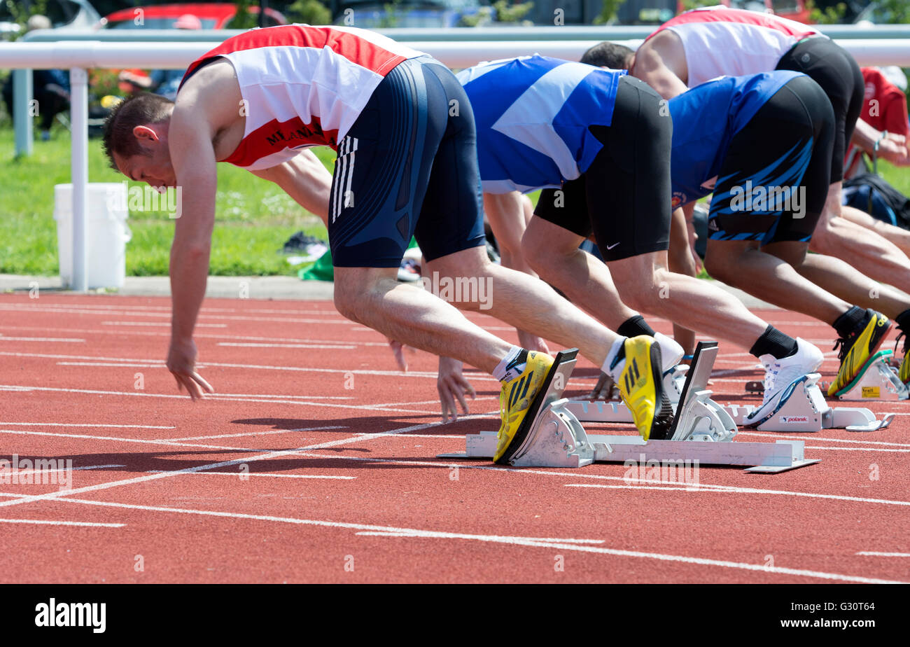 Masters athletics UK. Men`s 100m race start Stock Photo - Alamy
