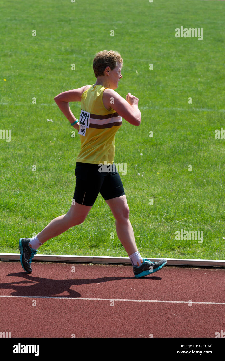 Masters athletics UK. Female athlete in a walking race Stock Photo - Alamy