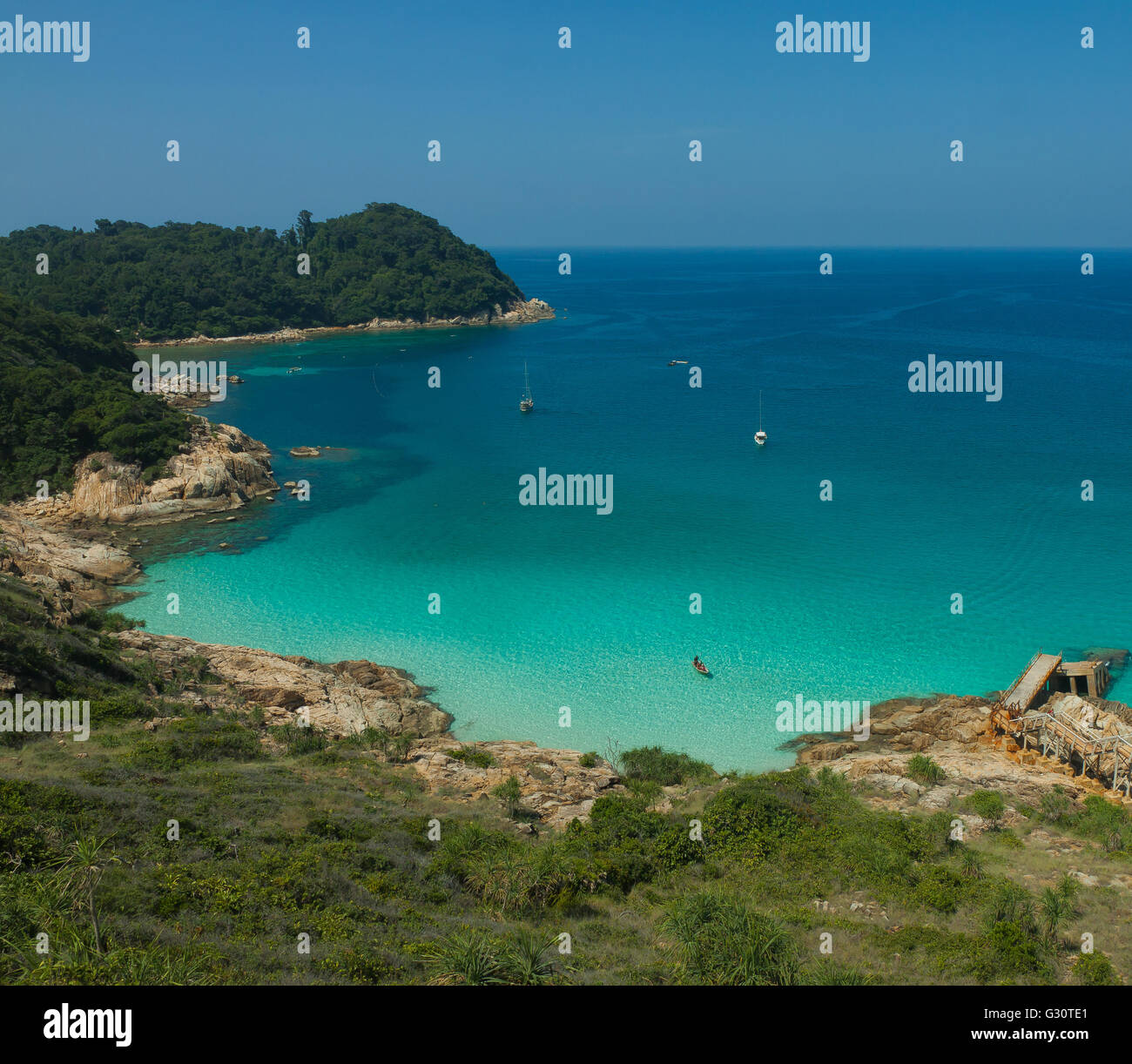 Boat floating at crystal clear waters next to a paradise island in ...