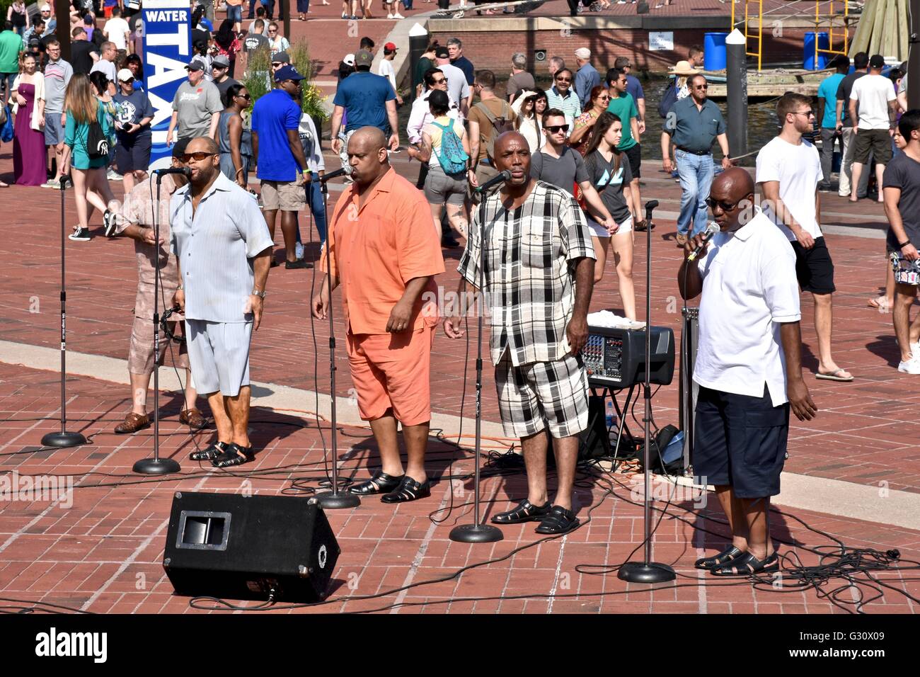 A group of men perform some blues in the Baltimore inner harbor Stock ...