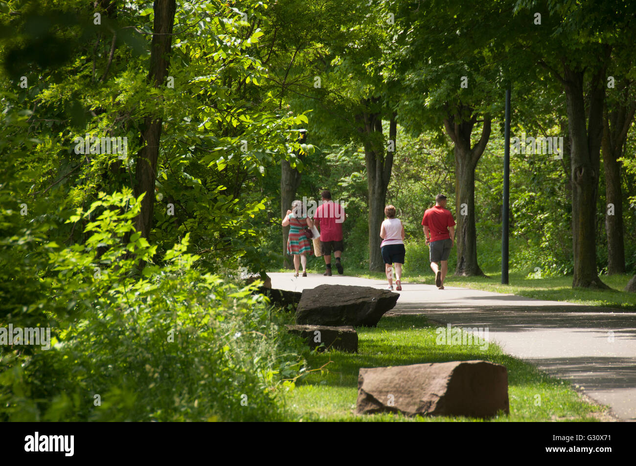 Joggers on Erie Canal path Stock Photo - Alamy