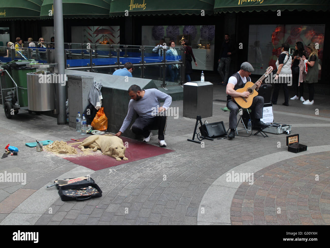 Sand sculpture and street artist outside Harrods Knightsbridge London ...