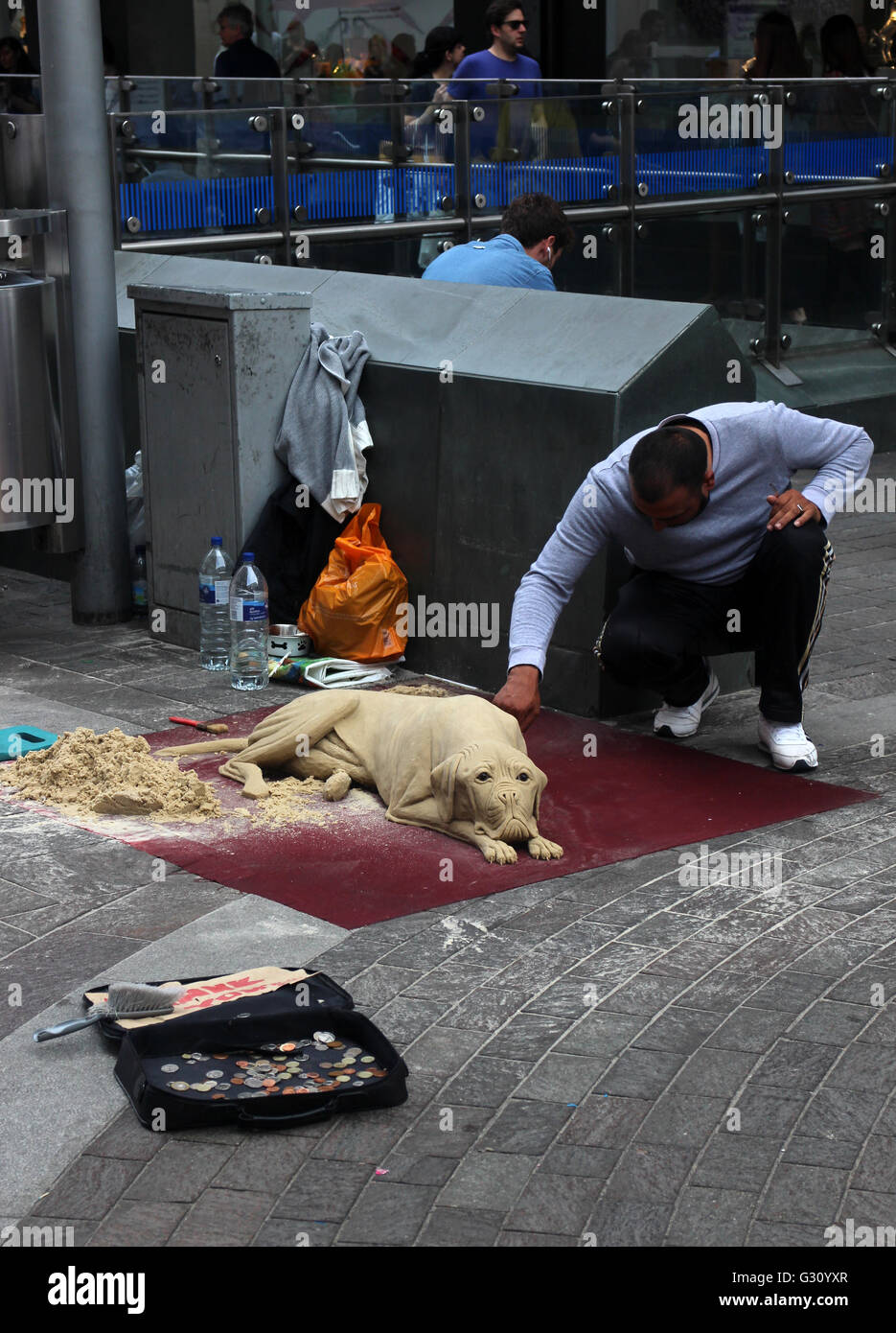 Sand sculpture street artist outside Harrods Knightsbridge London Stock ...