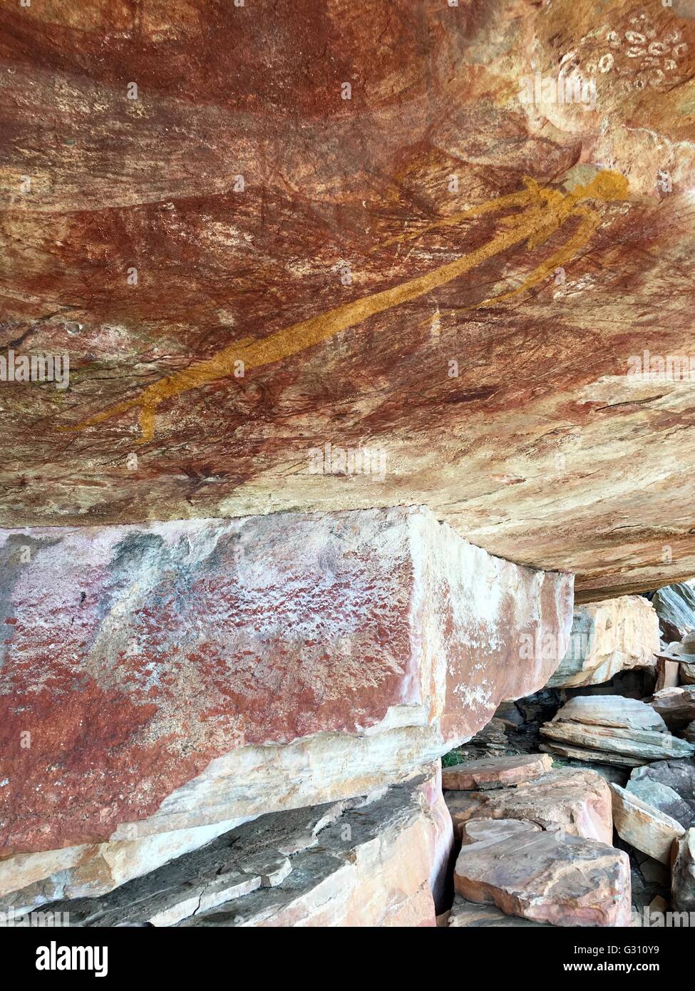 A yellow human figure painted in a cave at 'The Castle' at Gubara in ...
