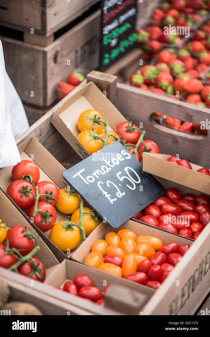 fresh tomatoes at farmer local market stall Stock Photo - Alamy