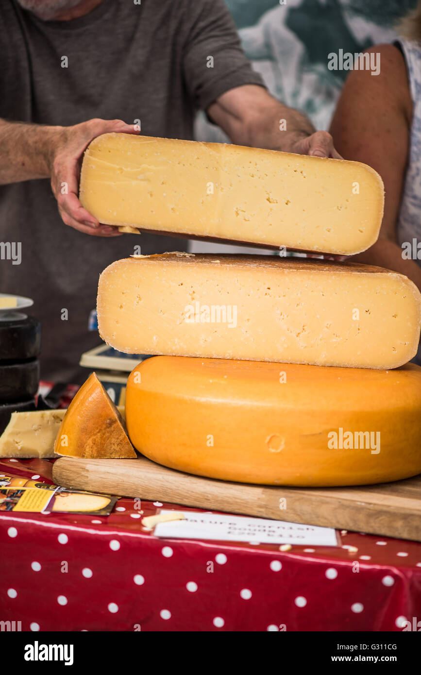 man handle artisan cheese at food festival Stock Photo - Alamy