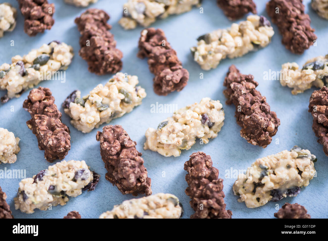 chocolate and granola healthy snacks, flat lay overhead pattern Stock ...