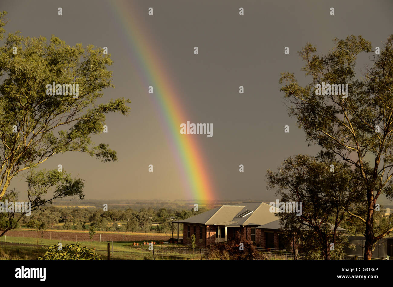 Rainbow over a house in farming country Stock Photo - Alamy