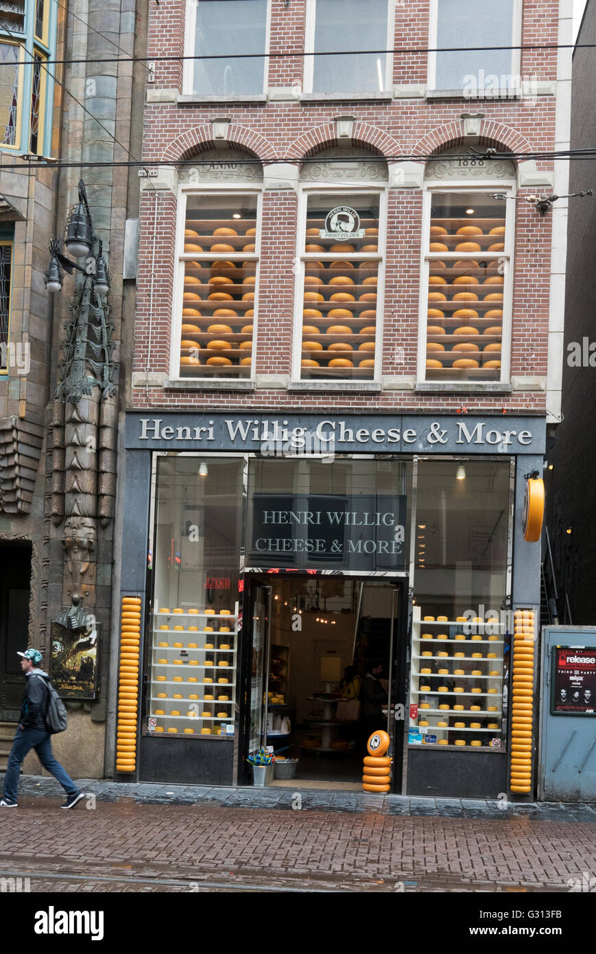 The exterior of a cheese shop with yellow cheese on shelves in ...