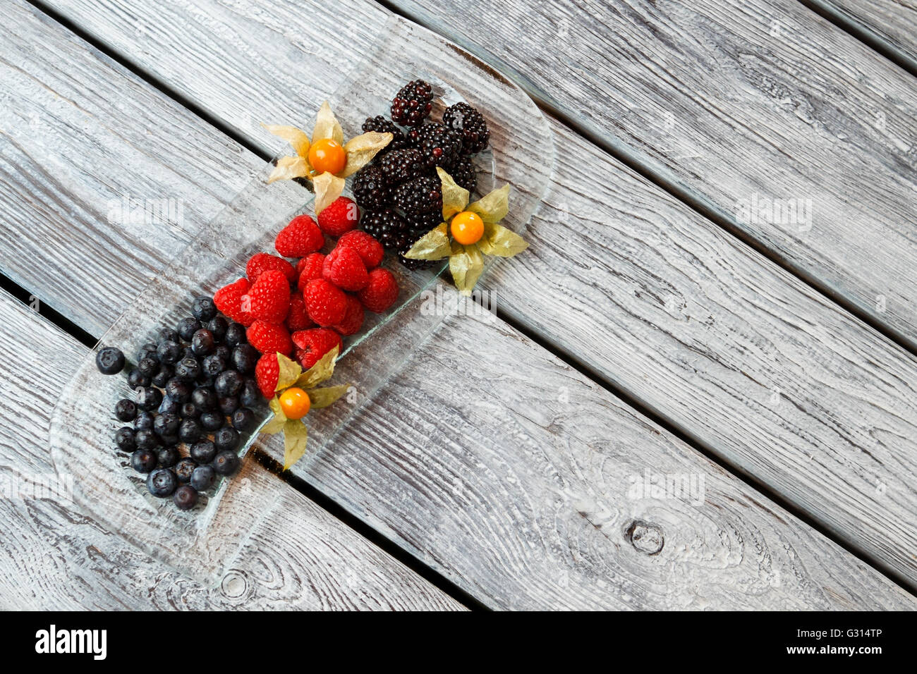 Blueberry and raspberry on plate Stock Photo - Alamy