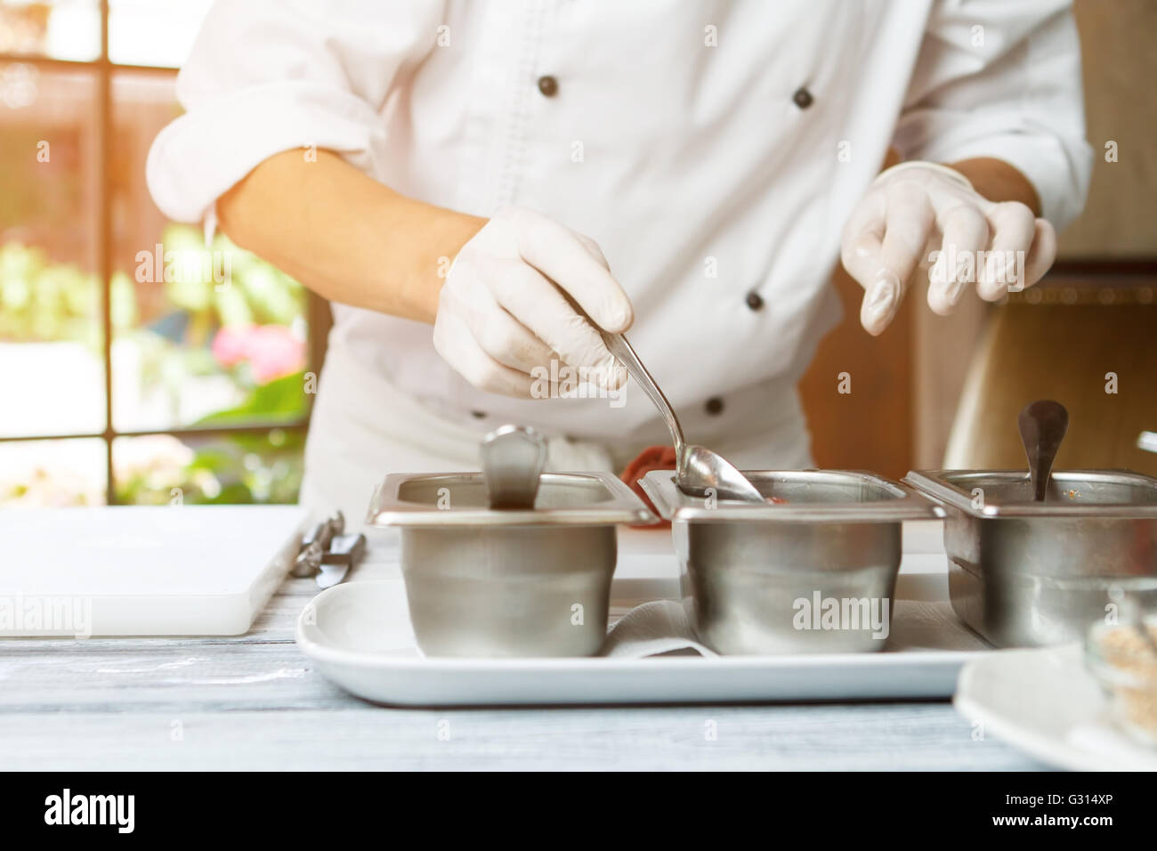Man's hand holding spoon Stock Photo - Alamy