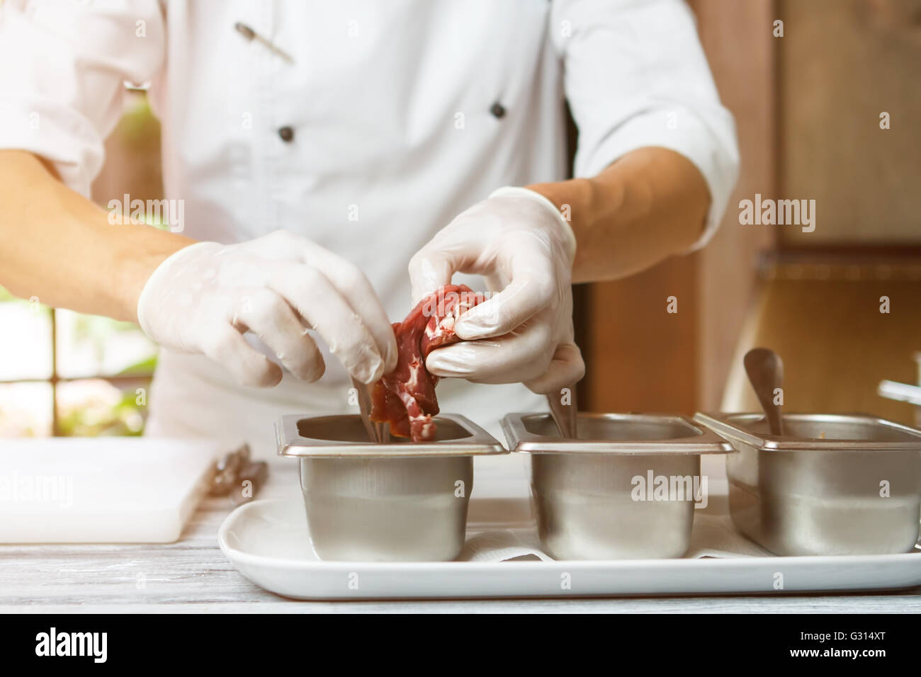 Man's hands holding meat Stock Photo - Alamy
