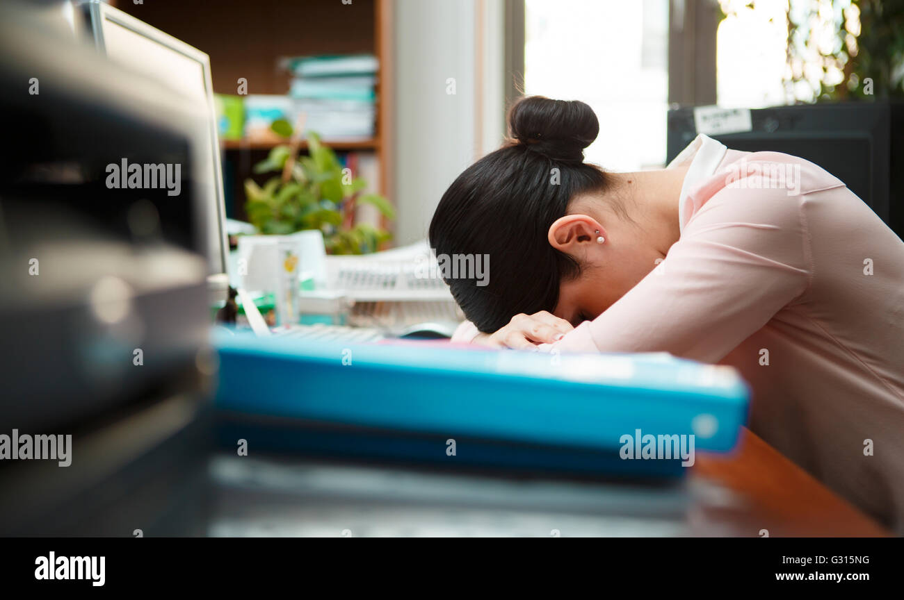 Tired businesswoman sleeping on the desk Stock Photo - Alamy